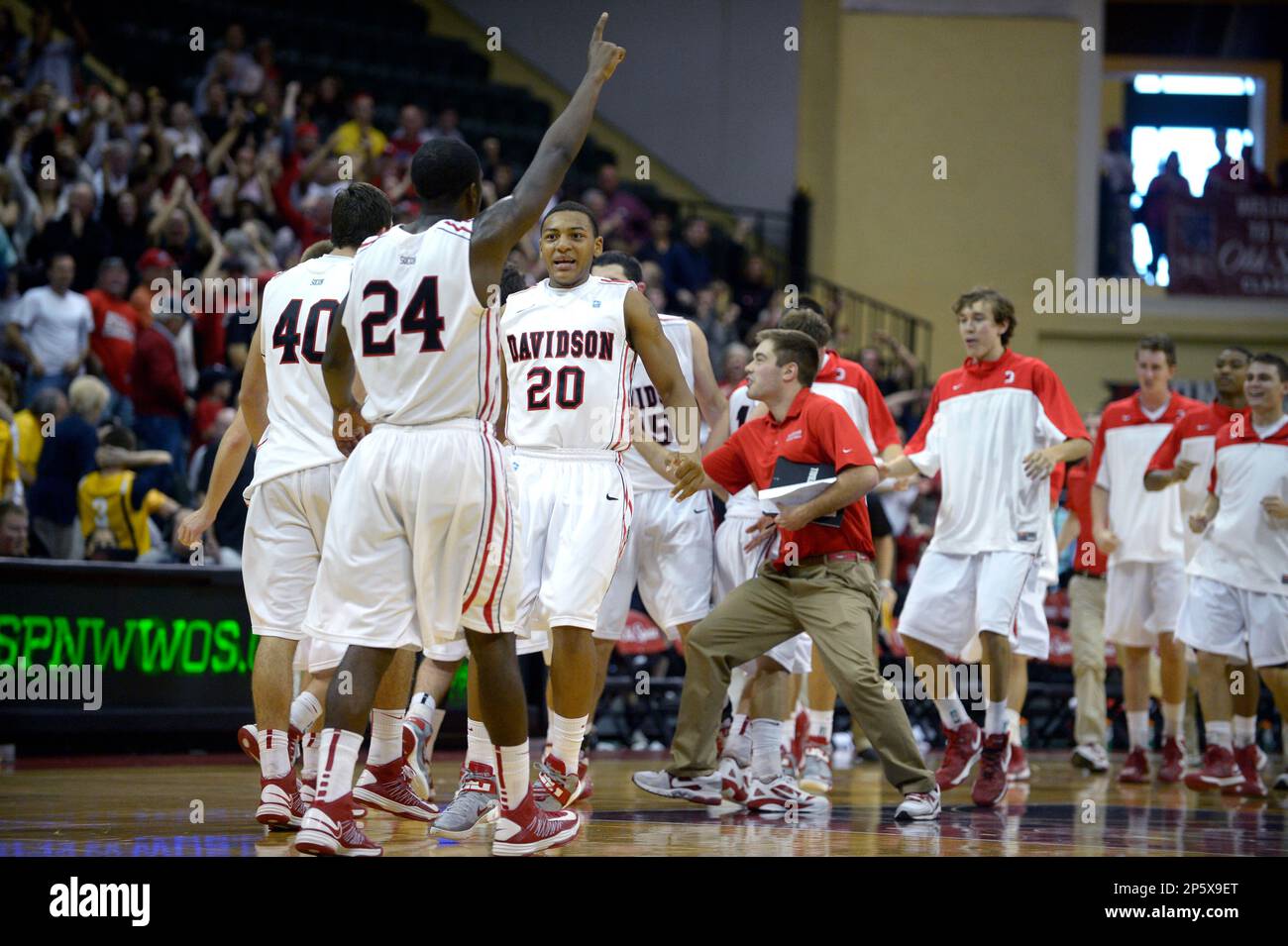 Davidson forward De'Mon Brooks (24) celebrates as guard Jordan Barham ...