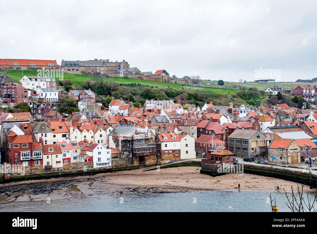 The red rooves of properties below Whitby Abbey and alongside the ...