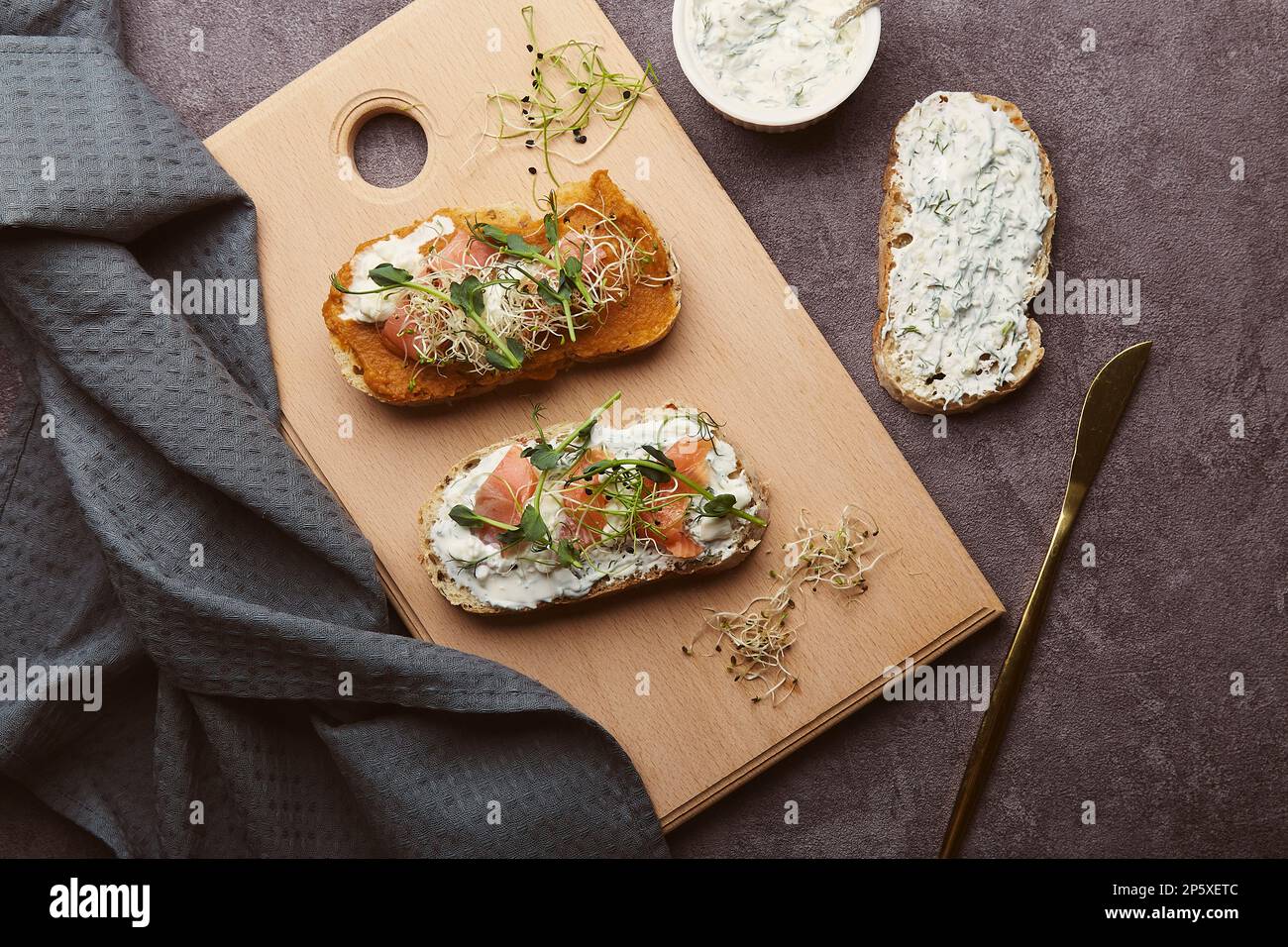 Sandwiches with zucchini and cream cheese spread, fish, alfalfa ...