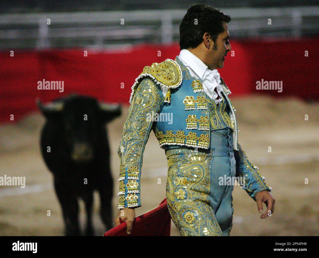 Professional bullfighter Manolo Martinez Jr. taunts a bull during a ...