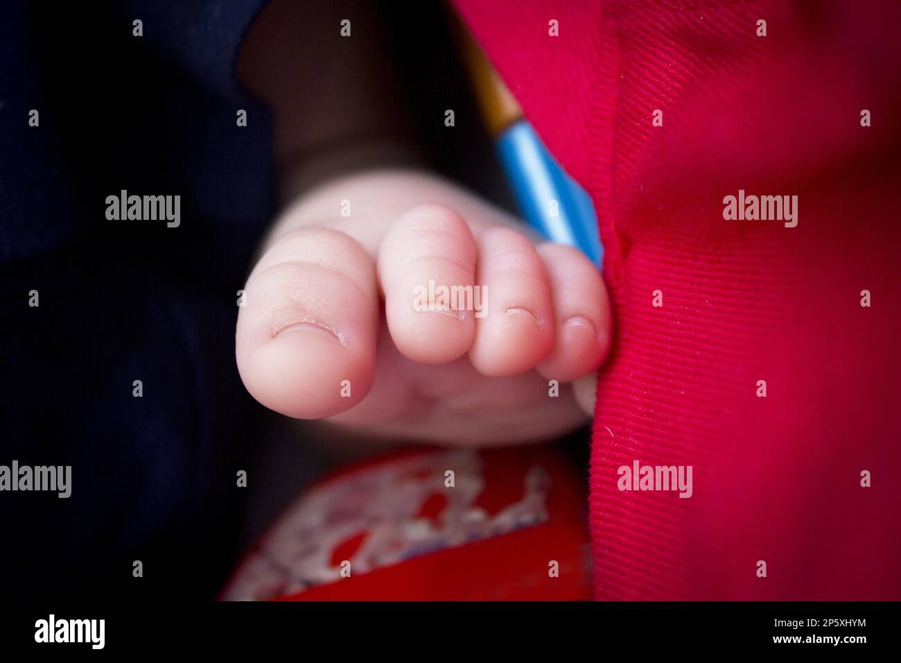 Two month old baby feet on black background. Sweet scene Stock Photo ...