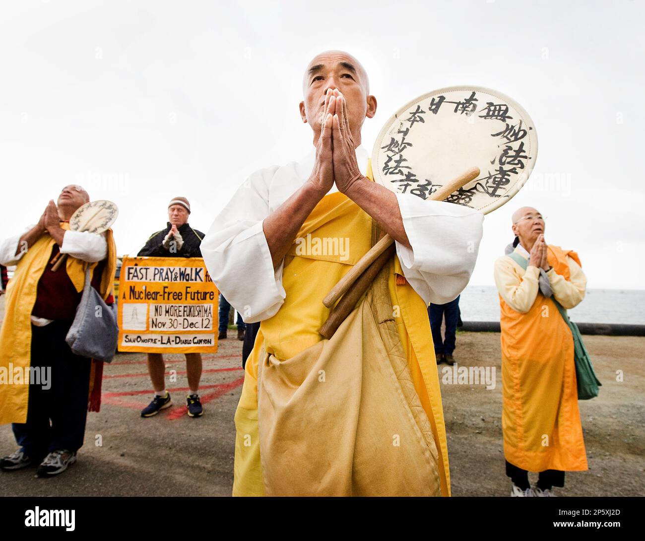 Buddhist nun Gyojun Yasuda, right, and monks Gyosen Sawada, center, and ...