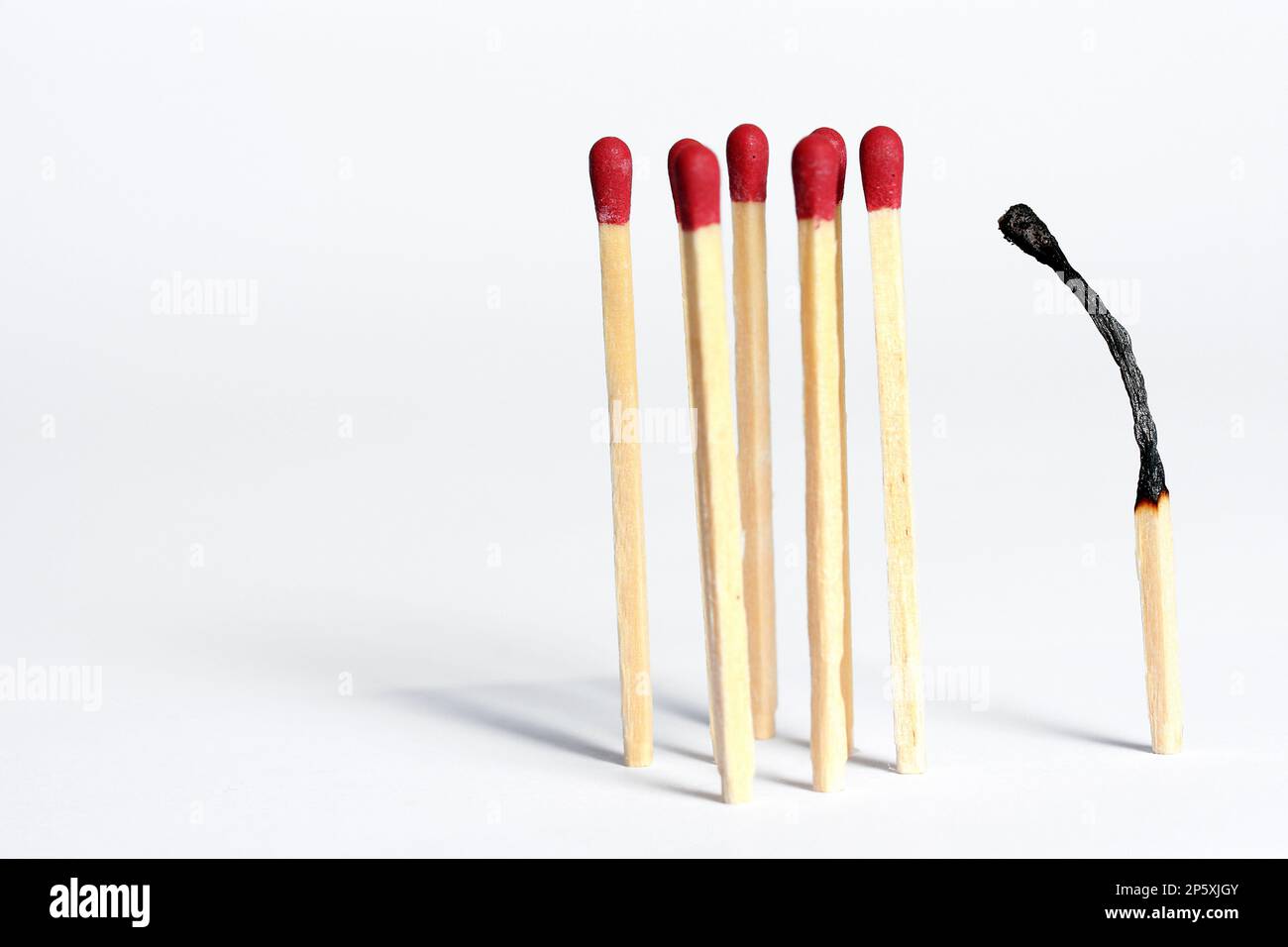 group of matches, a single one burnt off Stock Photo - Alamy