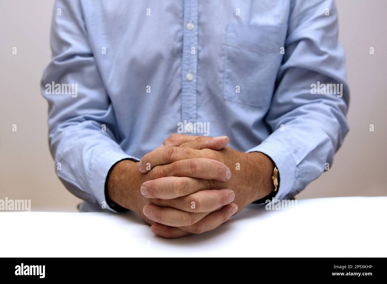 folded hands pf a man Stock Photo - Alamy