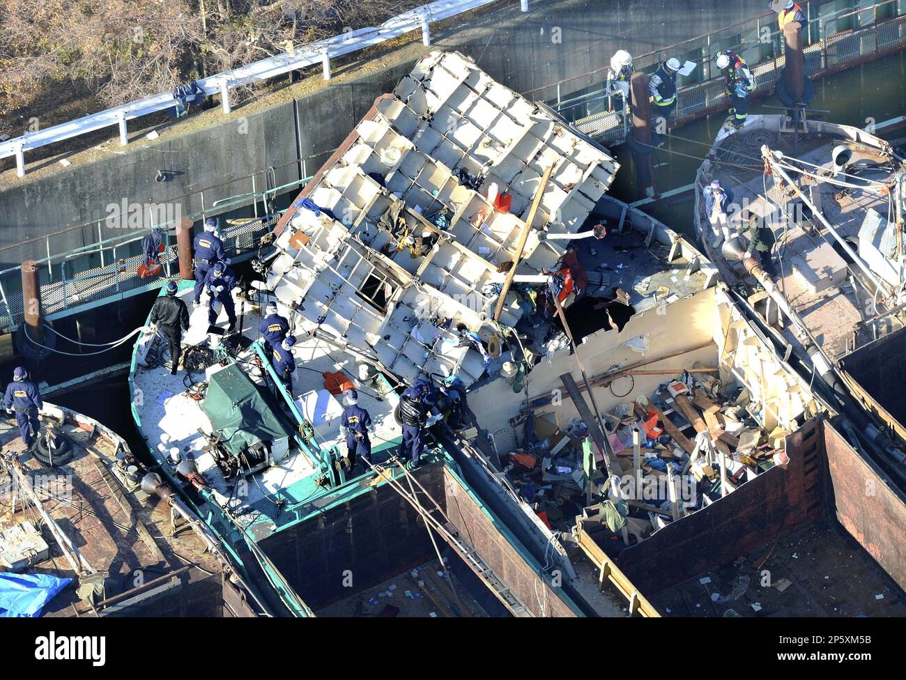 A picture shows a barge vessel " Seiwa-maru '' exploded on the Okawa ...
