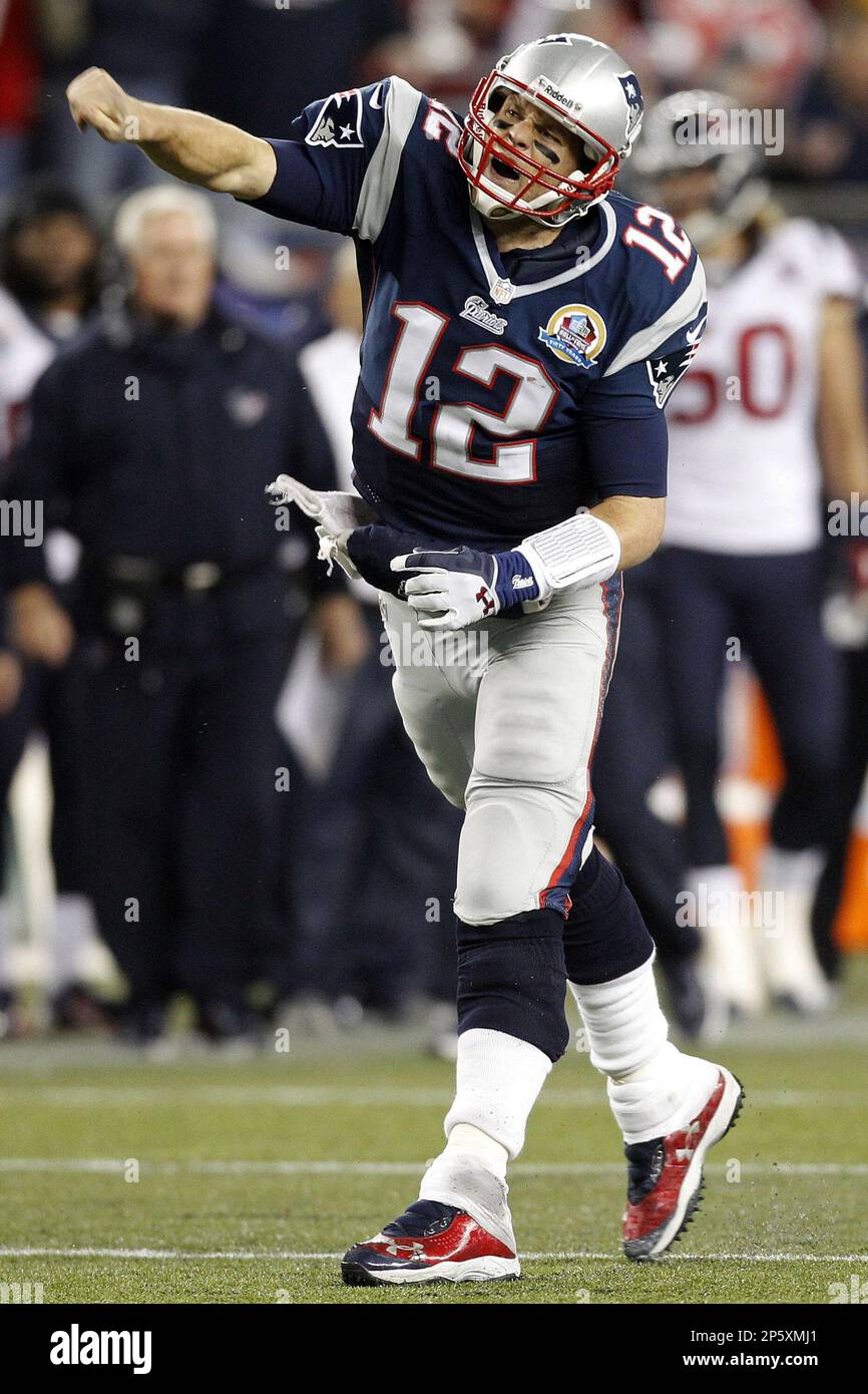 New England Patriots quarterback Tom Brady (12) reacts after running ...