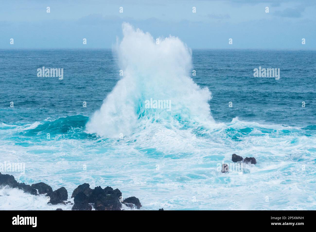 Two waves collide with each other in the sea Stock Photo - Alamy