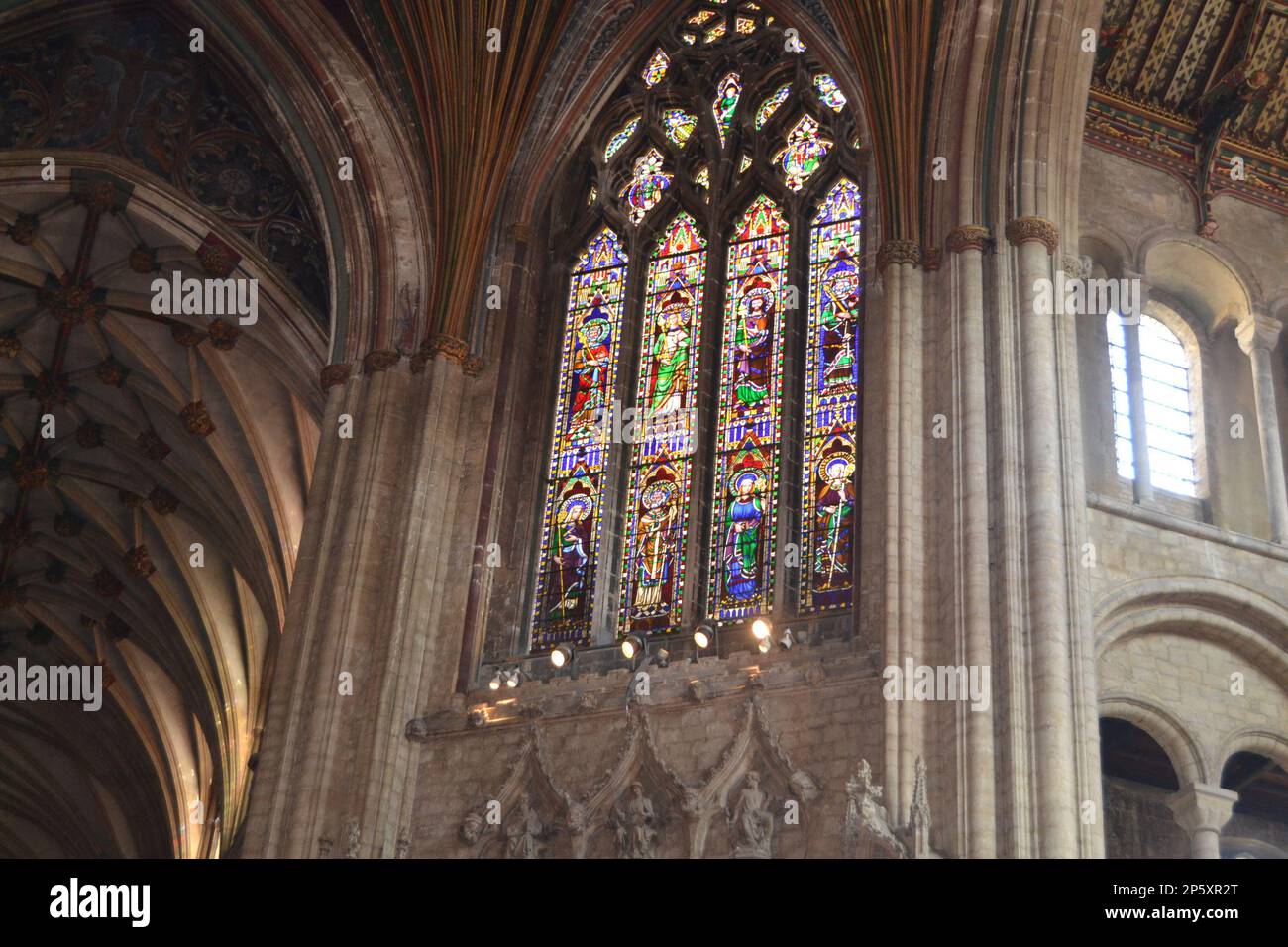 A large and impressive stained glass window featured prominently in a ...