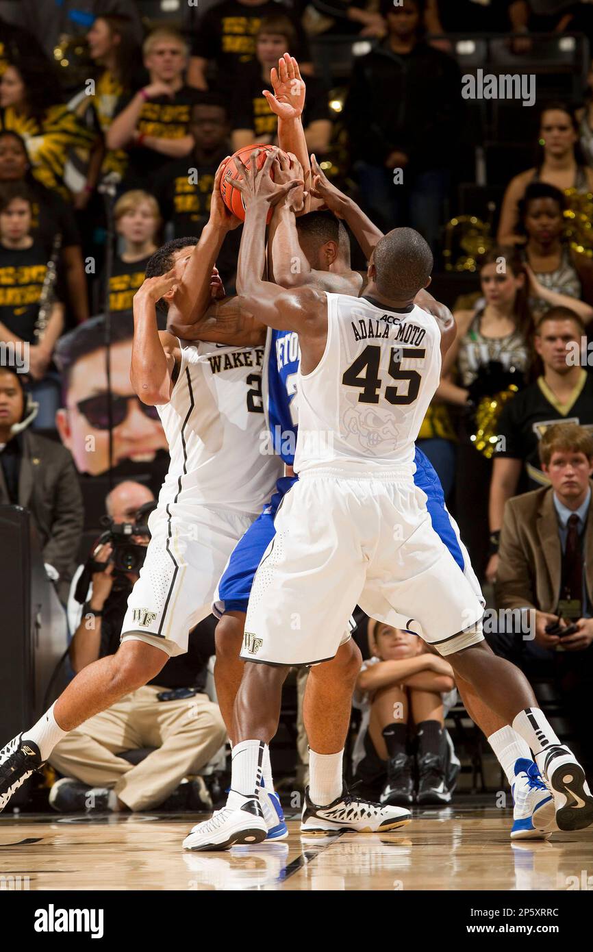 Eugene Teague (21) of the Seton Hall Pirates is double-teamed by Arnaud ...