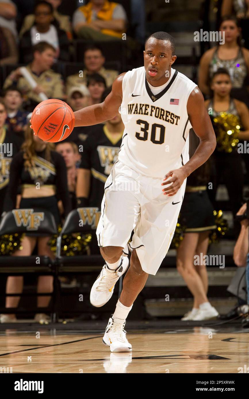 Travis McKie (30) of the Wake Forest Demon Deacons dribbles the ball up ...