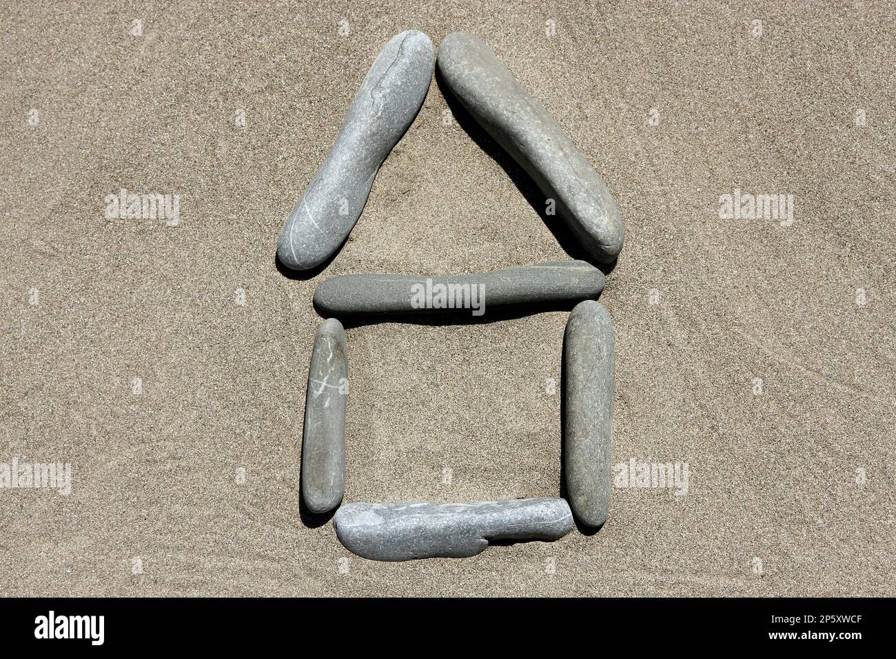 outline of a house of stones in the sand Stock Photo - Alamy