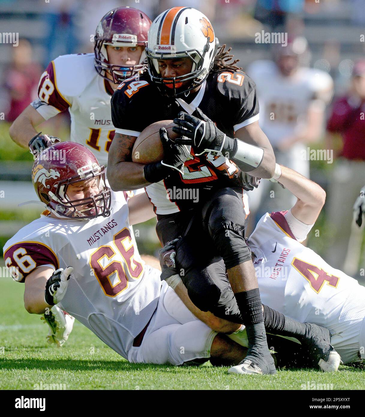 Fayette County's Darnell Williams is brought down by Madison Academy's ...
