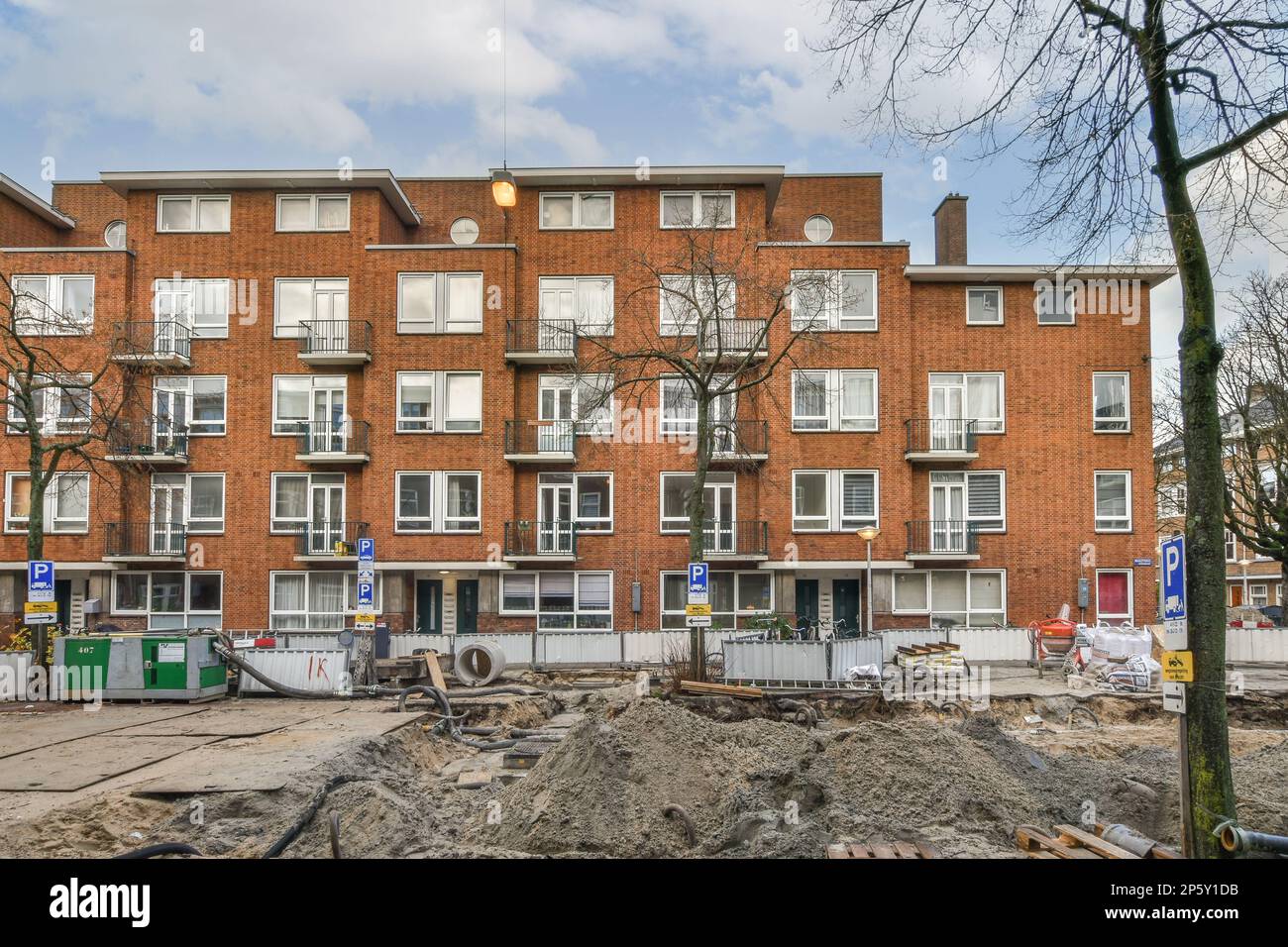 a building being built in the middle of an urban area with construction ...