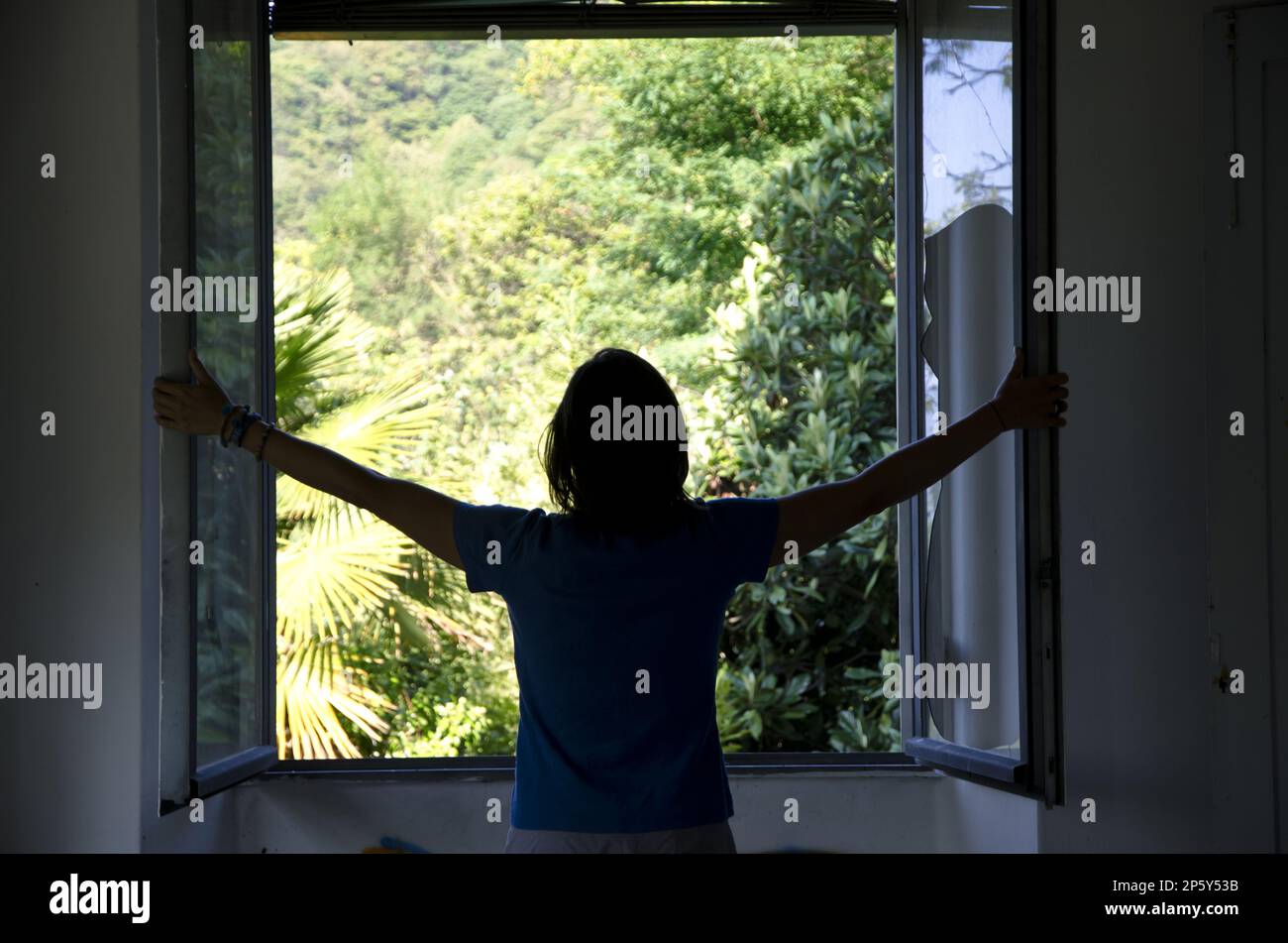 Woman Standing in a Abandoned Building Seen Through a Broken Window ...