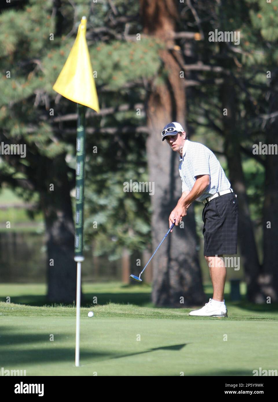 Aaron Rodgers of the Green Bay Packers putts during the American ...
