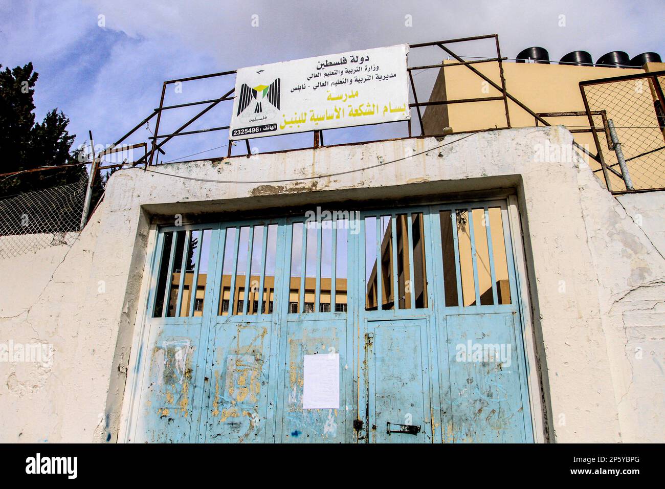 Nablus, Palestine - 07 Mar 2023, A view of the gate of a closed Palestinian school in the city ...