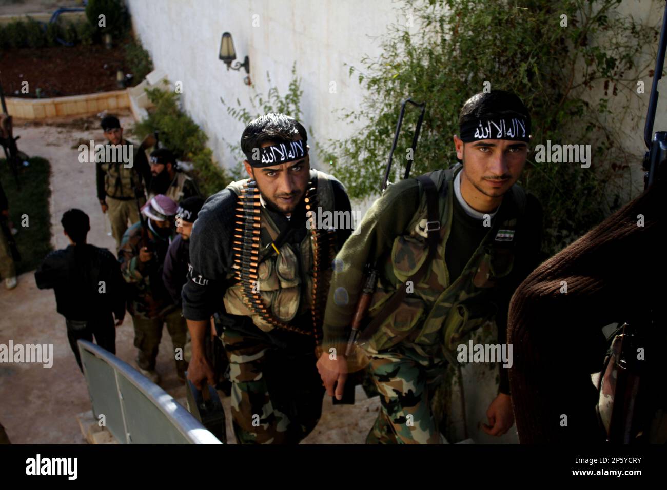 In this Wednesday, Nov. 14, 2012 photo, Syrian fighters of “The Beloved ...