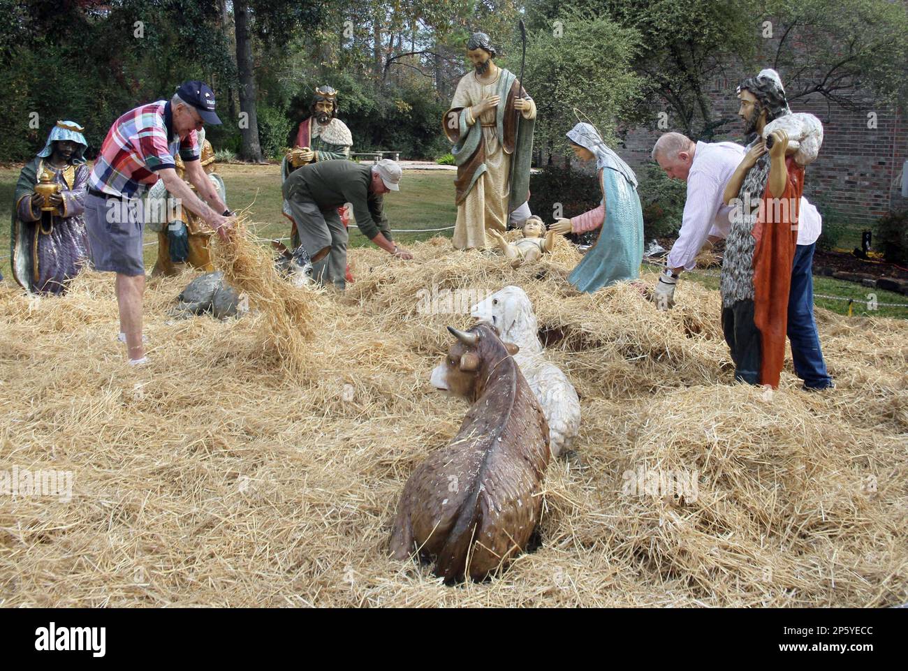 Grounds crew workers Larry Polich, right, and Roger Whitney help set up ...
