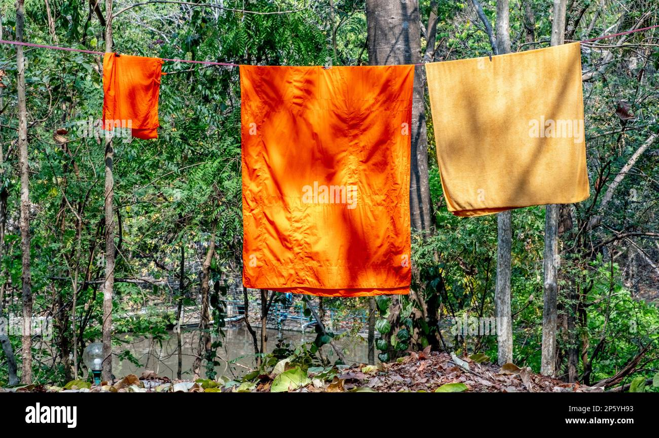 Yellow and orange monk robes drying on a line at the Wat Photi Khun ...