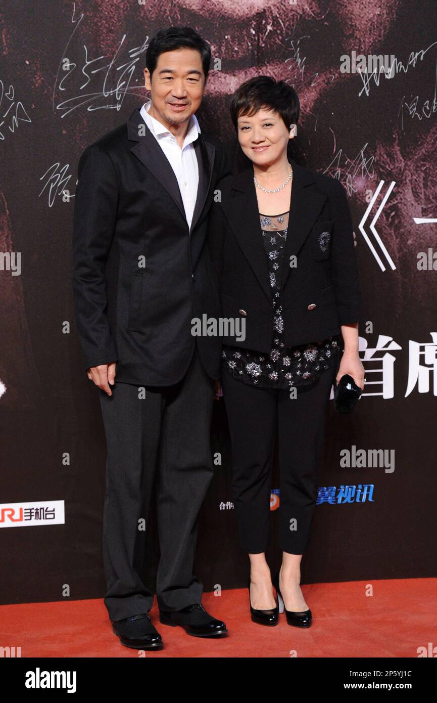 Actor Zhang Guoli and his wife Deng Jie attend the premier of director Feng Xiaogang's new film ...