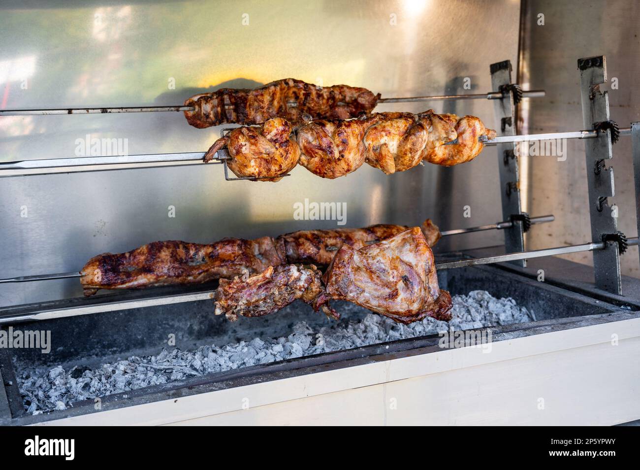 Roadside restaurants spit grill skewers barbecue in Crete, Greece. BBQ ...