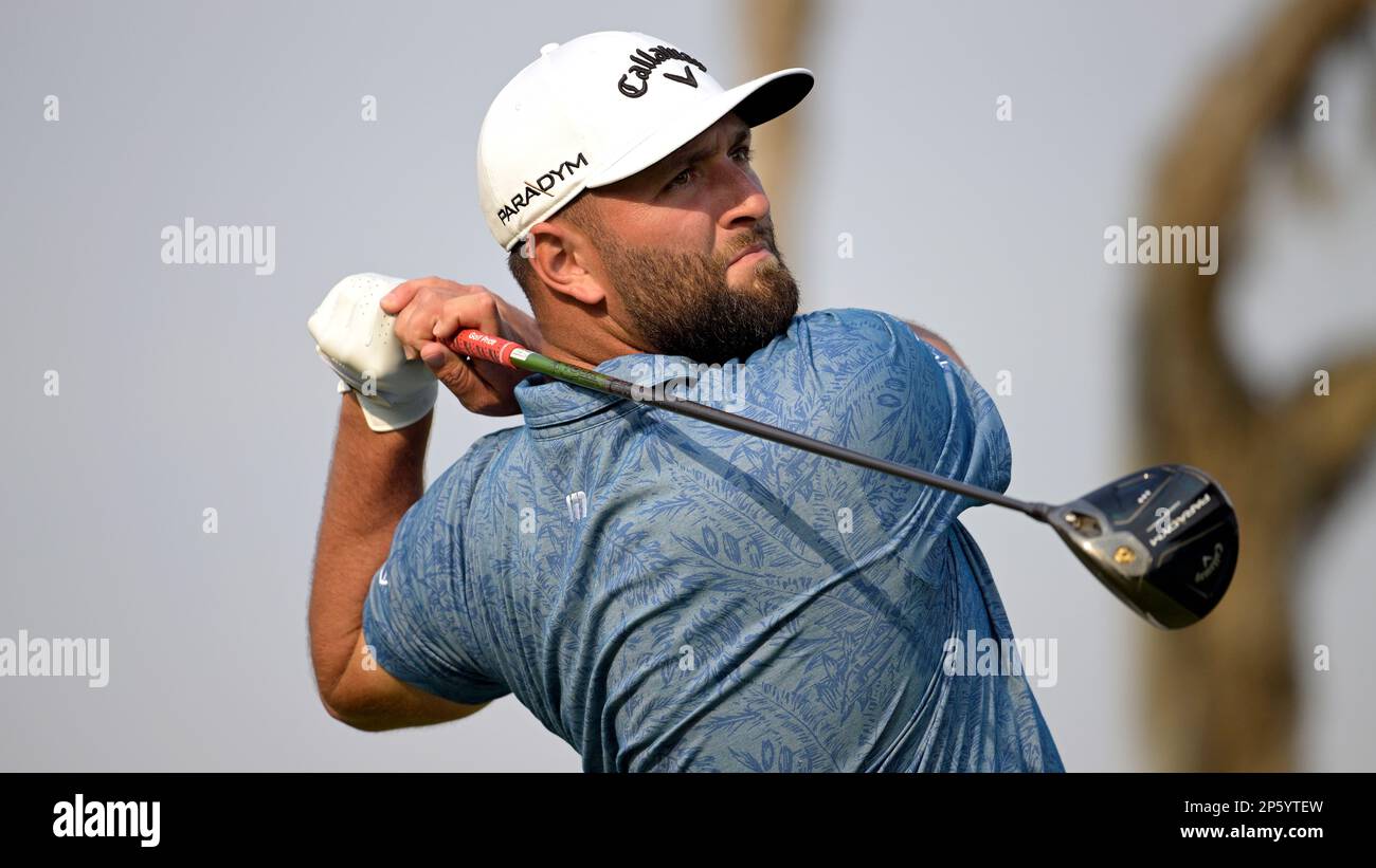 Jon Rahm, of Spain, watches after hitting his tee shot on the 15th hole ...