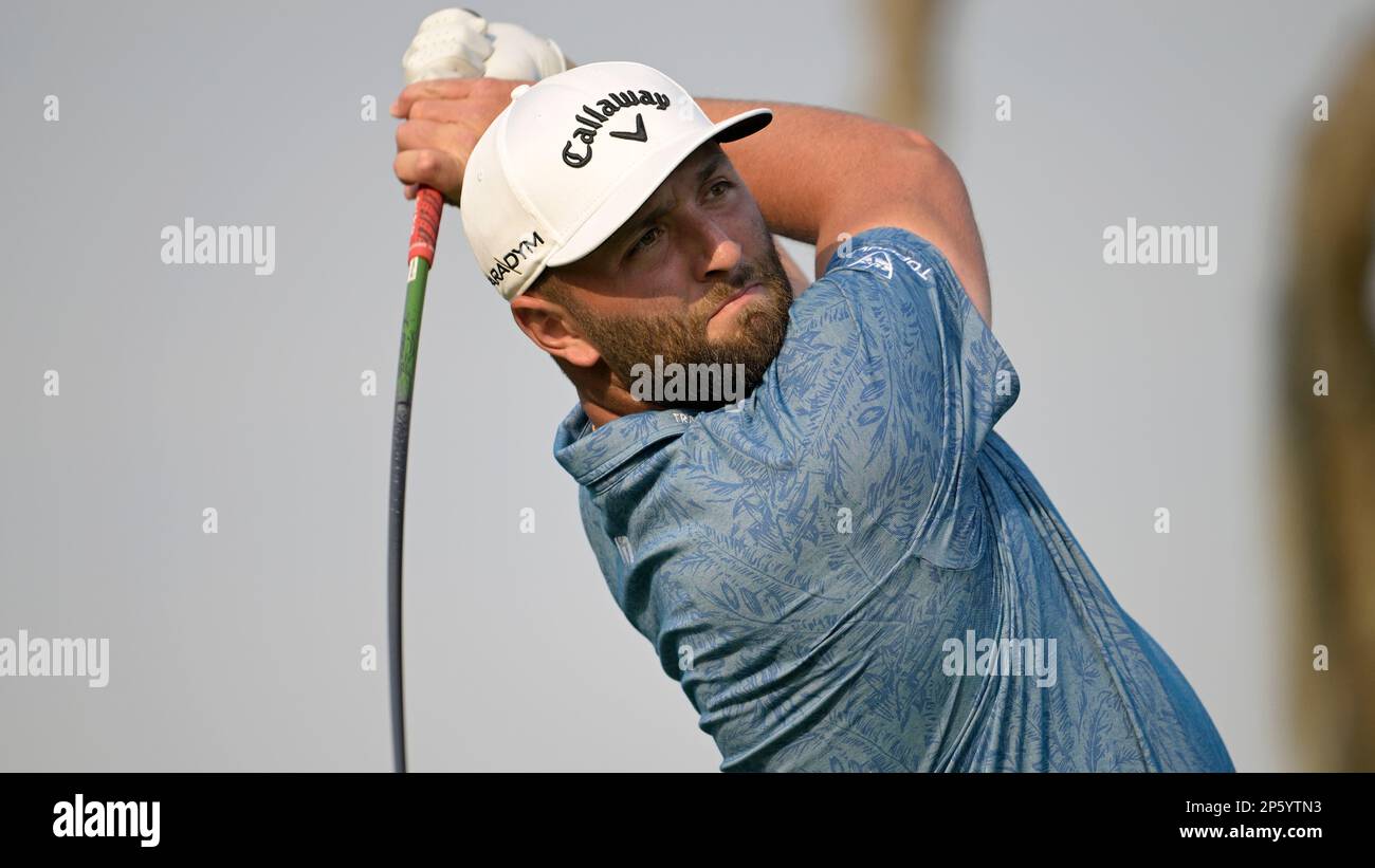 Jon Rahm, of Spain, watches after hitting his tee shot on the 15th hole ...