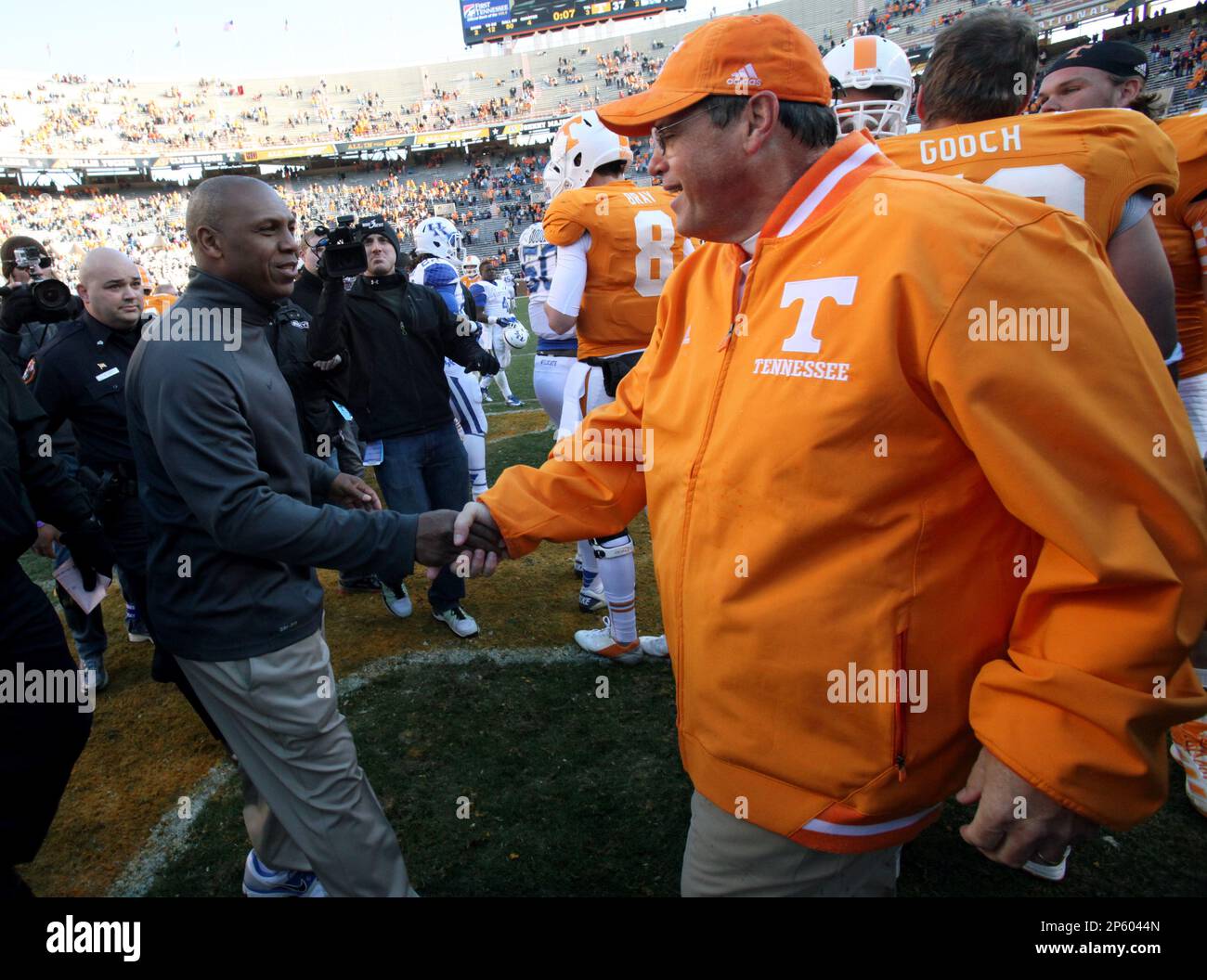 Tennessee interim head coach Jim Chaney, right, shakes hands with ...