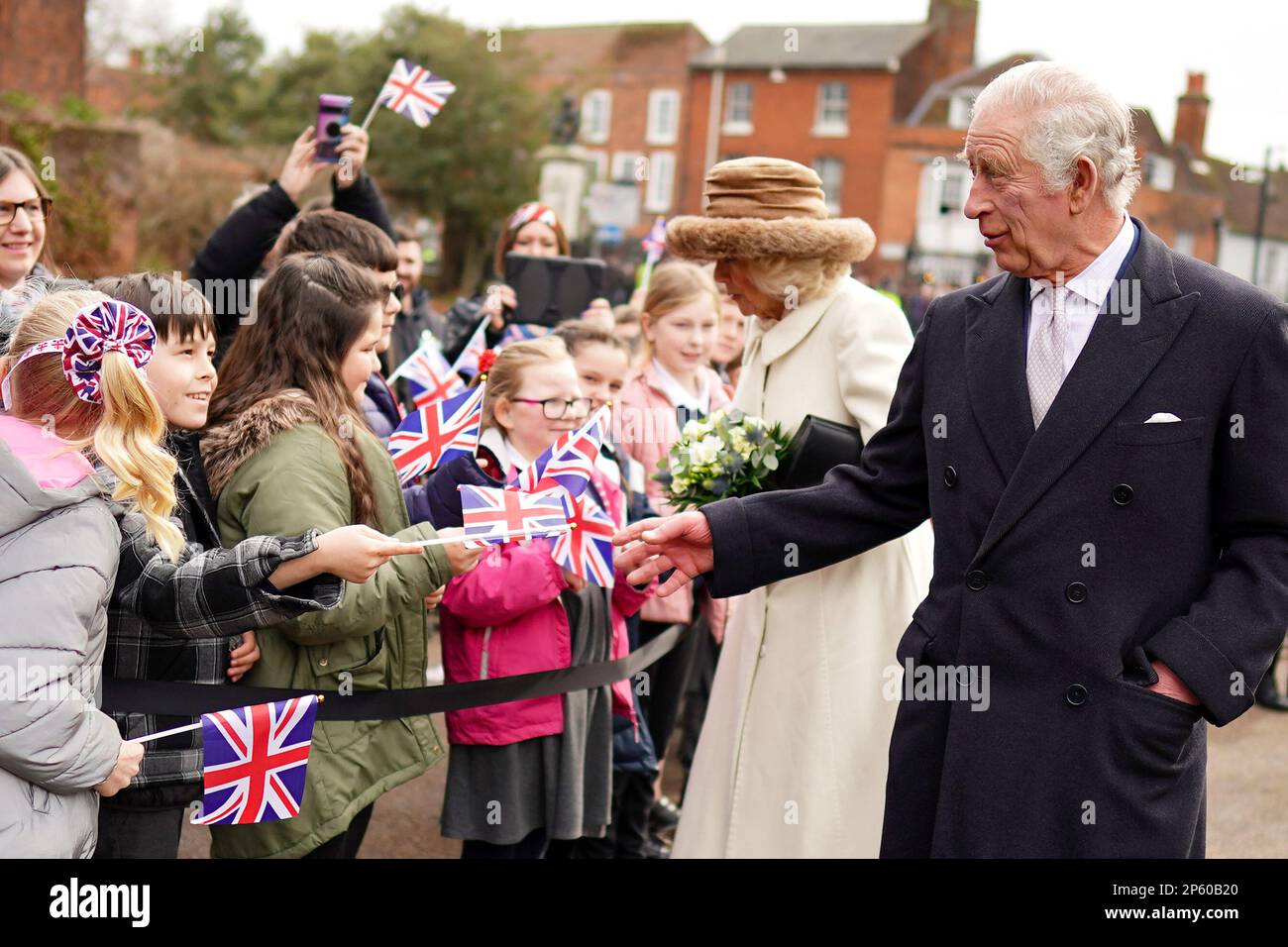 King Charles III and the Queen Consort speak with schoolchildren as ...