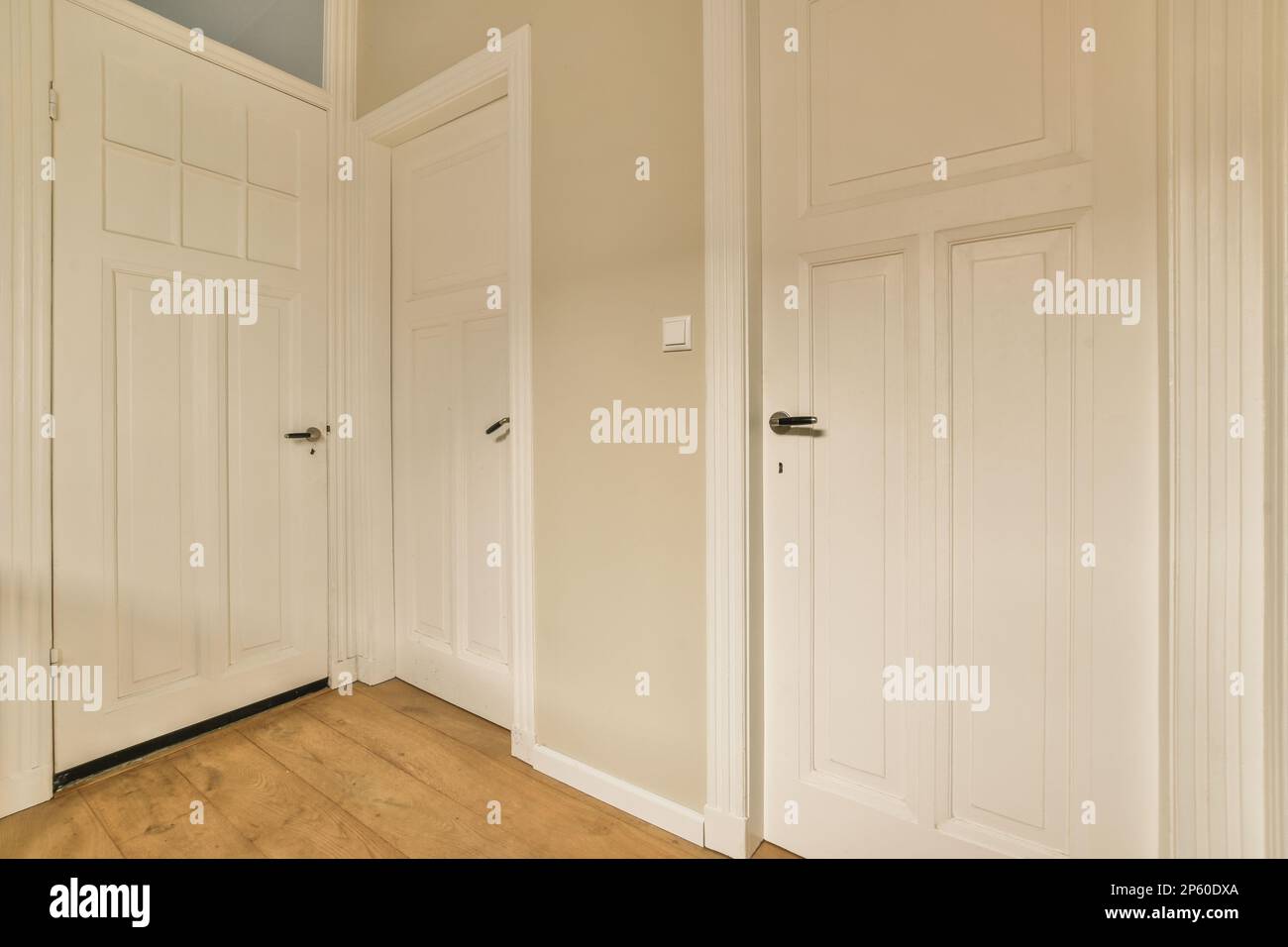 the inside of a room with two white doors and an open door that leads ...