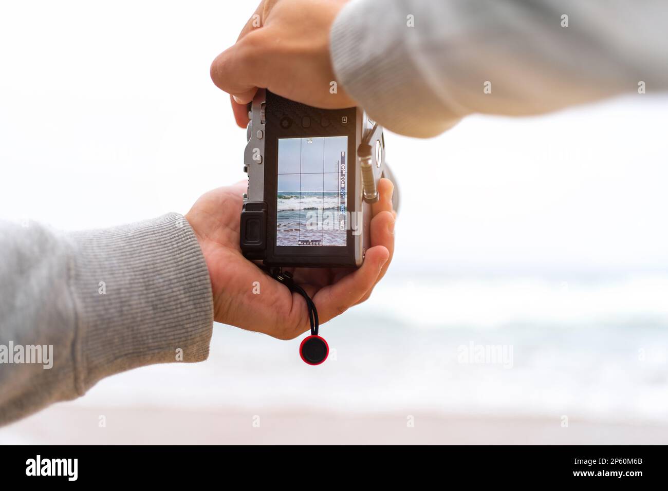 Traveller make photo using mirrorless camera in hand, travel blogger ...