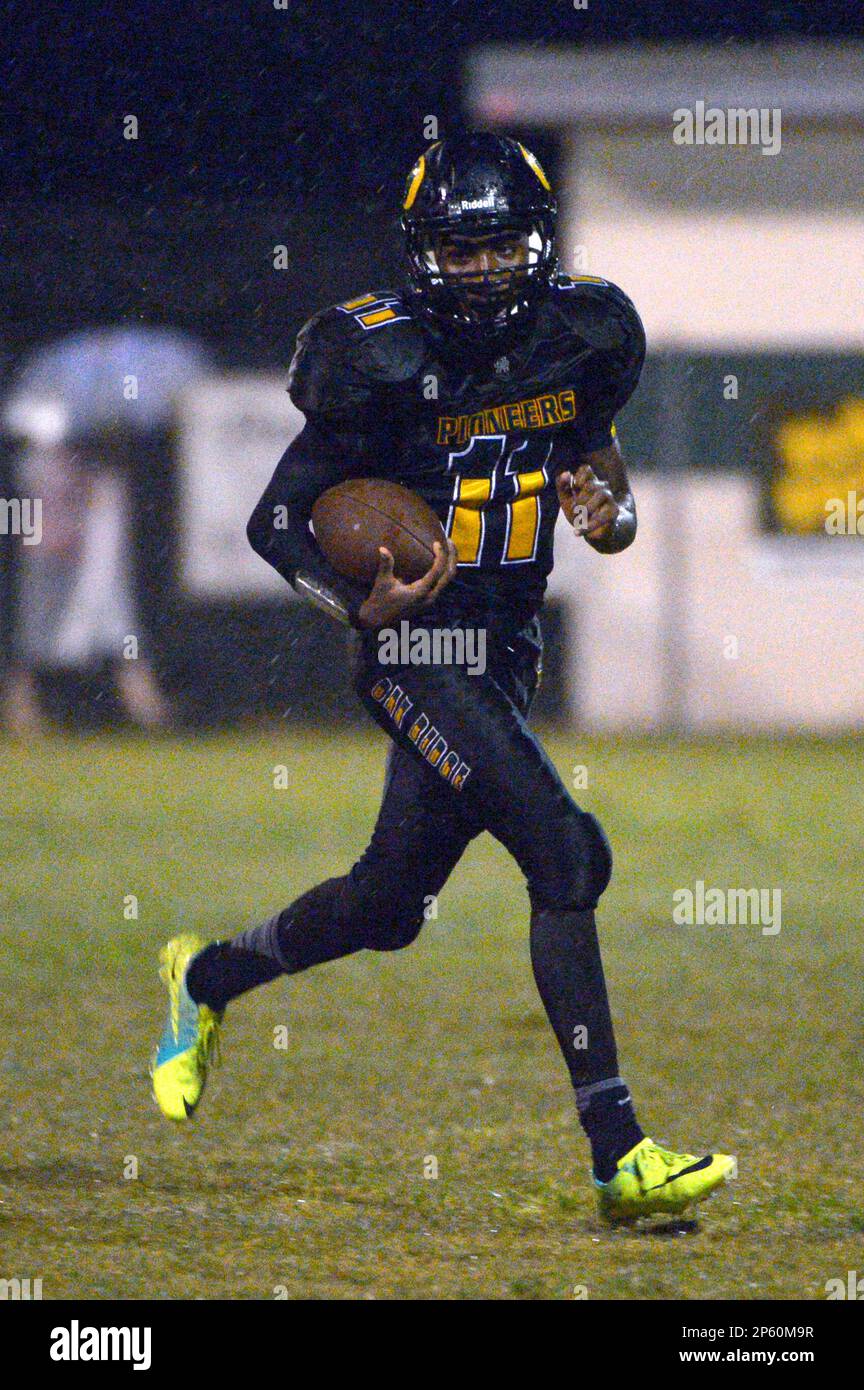 Oak Ridge quarterback Jerrell Antoine (11) scrambles for a first down ...