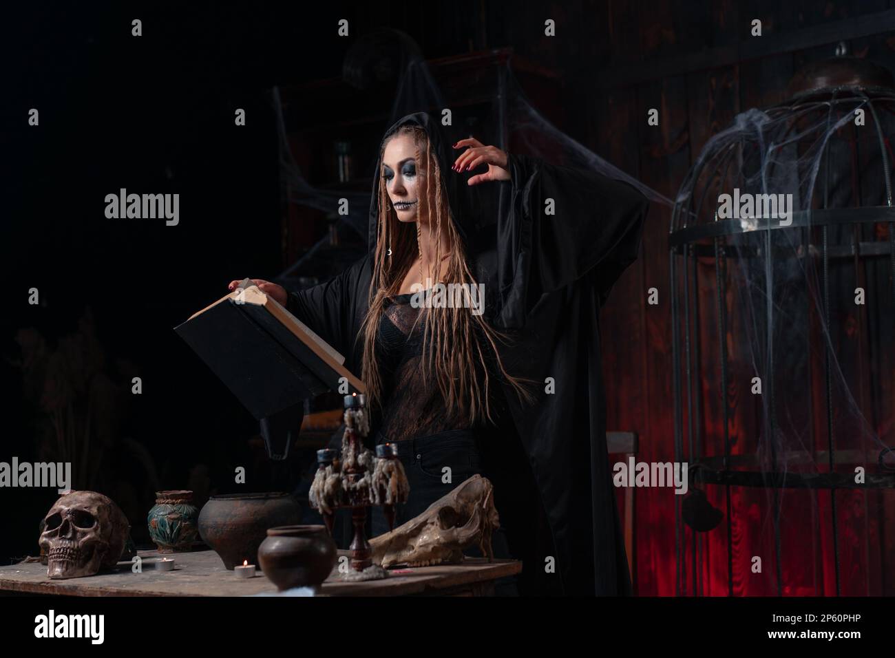 Halloween concept. Witch dressed black hood with copy space dark ...