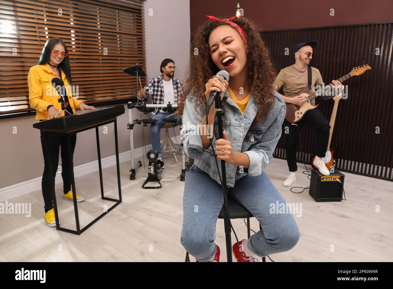 Young music player band friends hi-res stock photography and images - Alamy