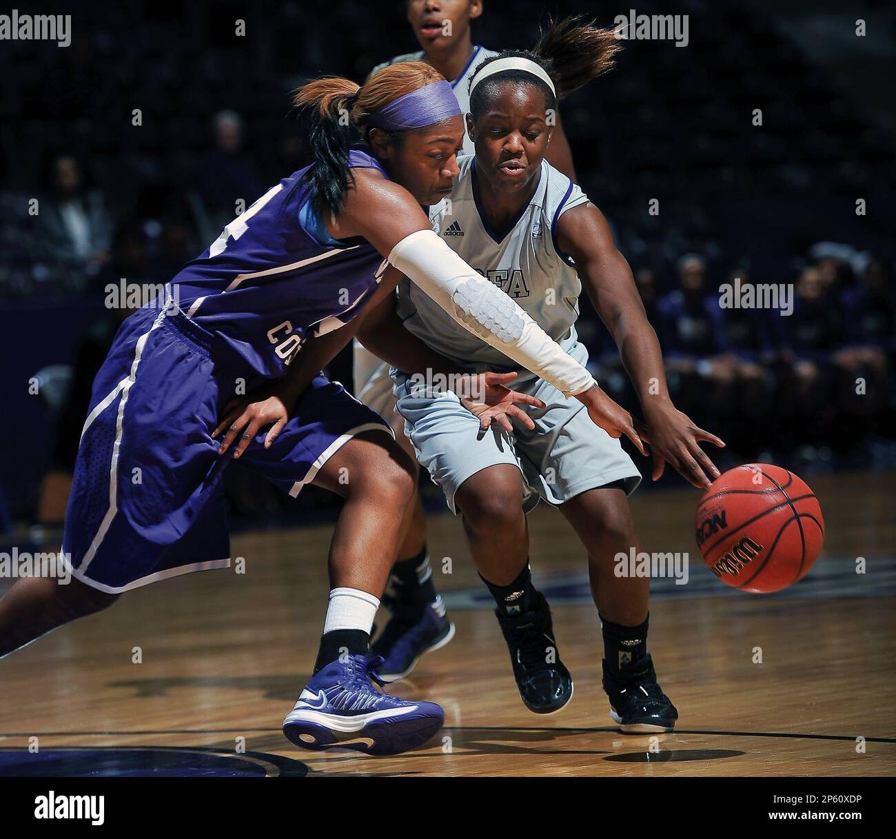 Wiley College senior forward Aliesha Carruthers, left, reaches in and ...