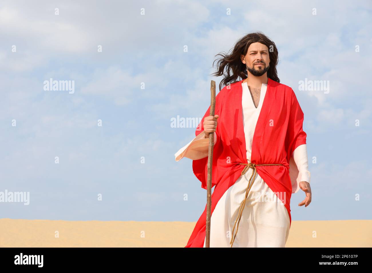 Jesus Christ walking with stick in desert. Space for text Stock Photo ...