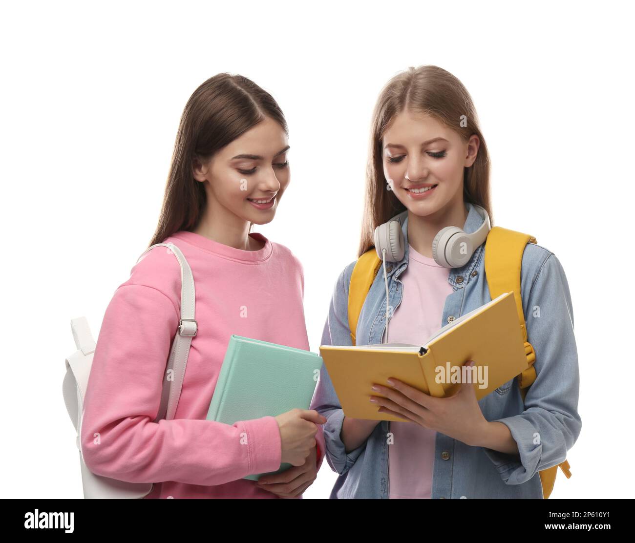 Teenage students with books and backpacks on white background Stock ...