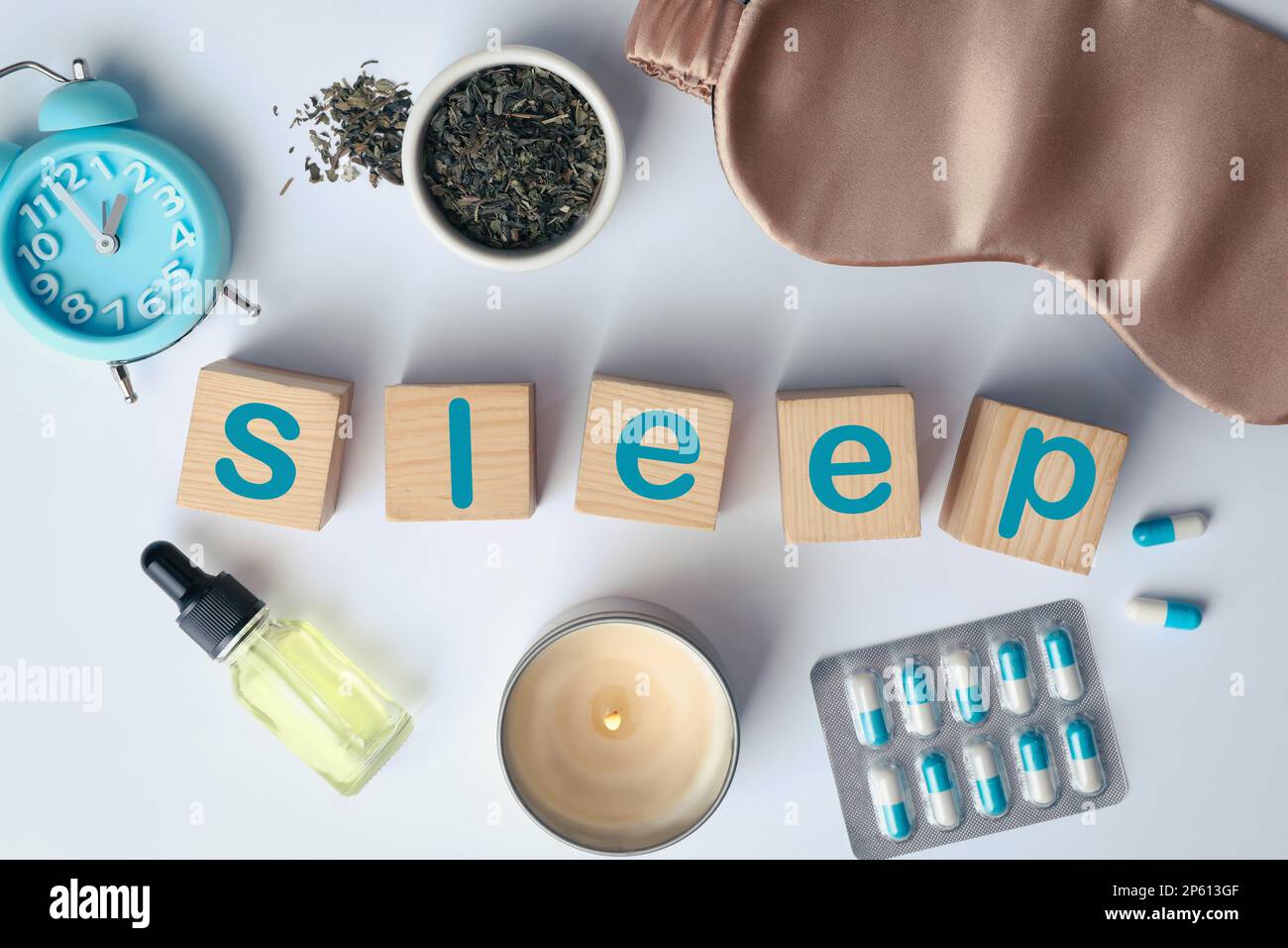 Flat lay composition with word Sleep made of wooden cubes and insomnia ...