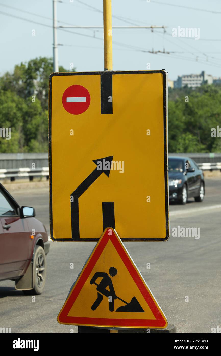 Traffic signs outdoors on highway. Road repair Stock Photo - Alamy