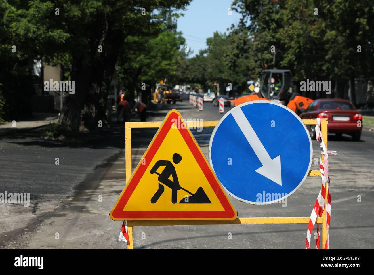Barricade with traffic signs on city street. Road repair Stock Photo ...