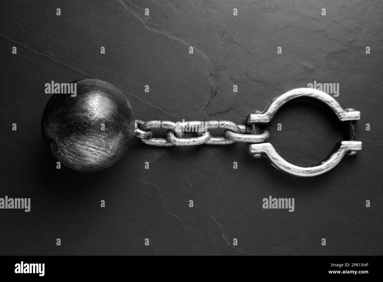 Prisoner ball with chain on black table, top view Stock Photo - Alamy