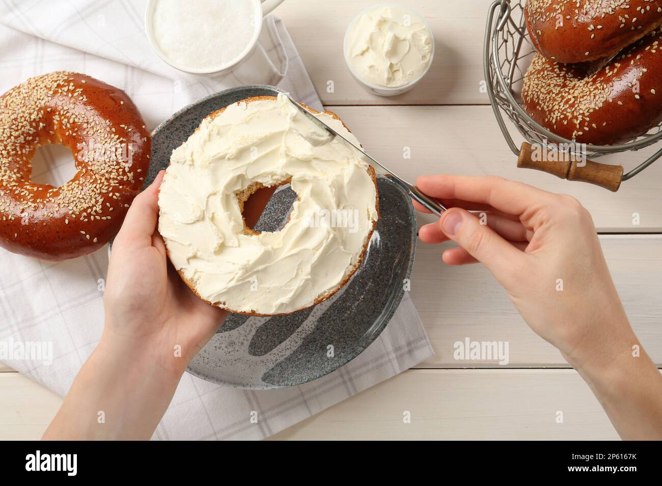 Woman making bagel cream hi-res stock photography and images - Alamy