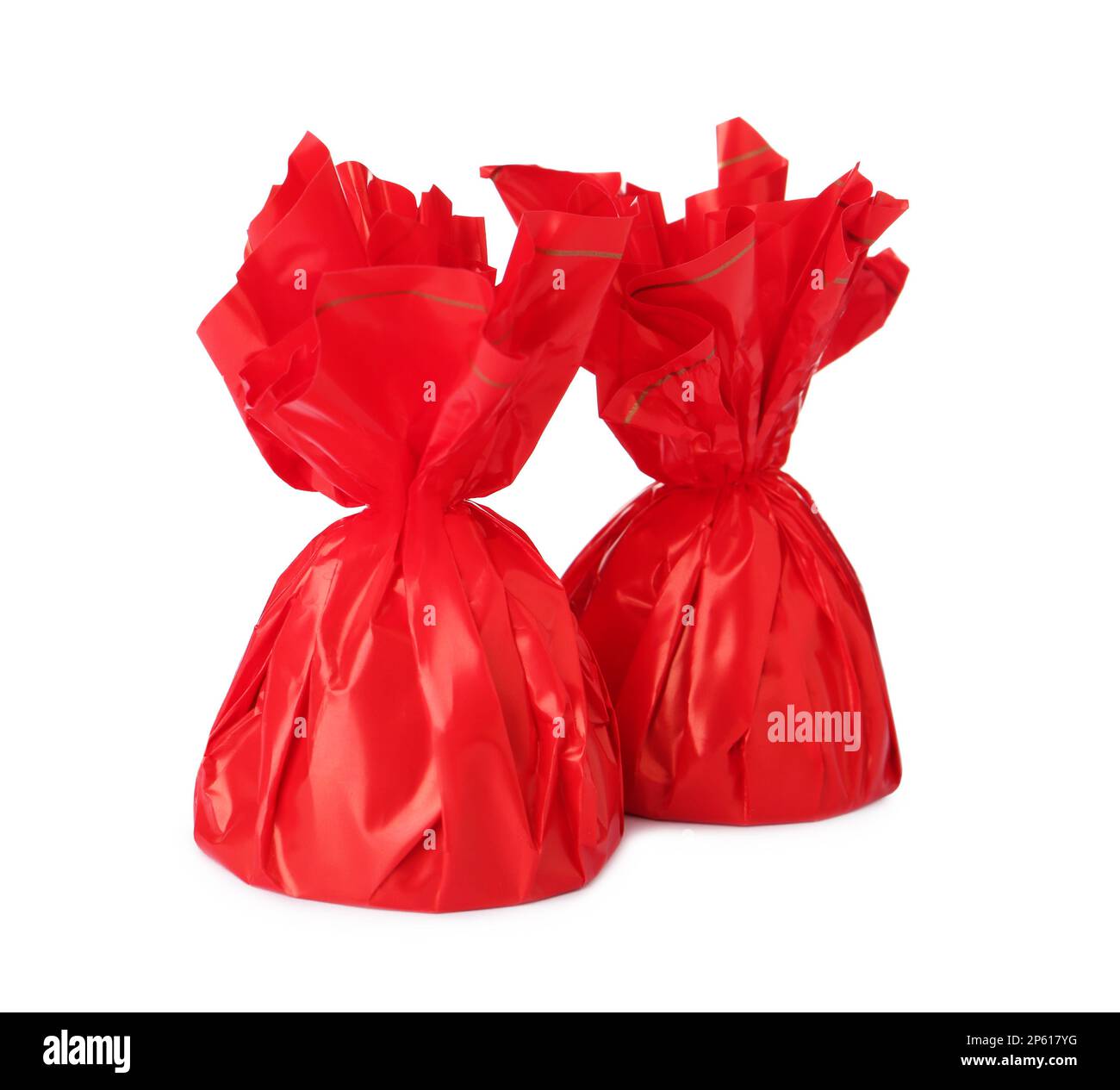 Delicious candies in red wrappers on white background Stock Photo - Alamy