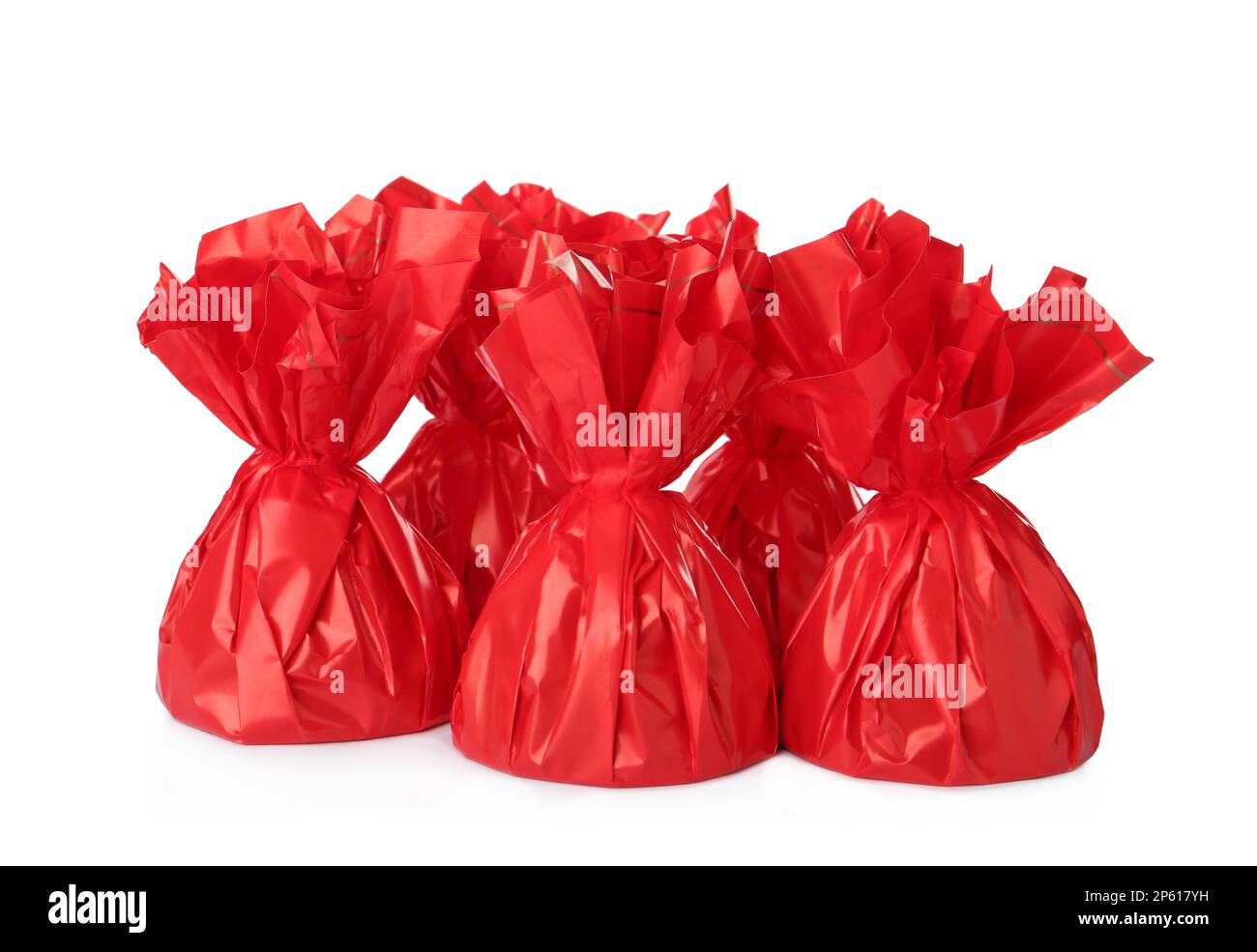 Delicious candies in red wrappers on white background Stock Photo - Alamy