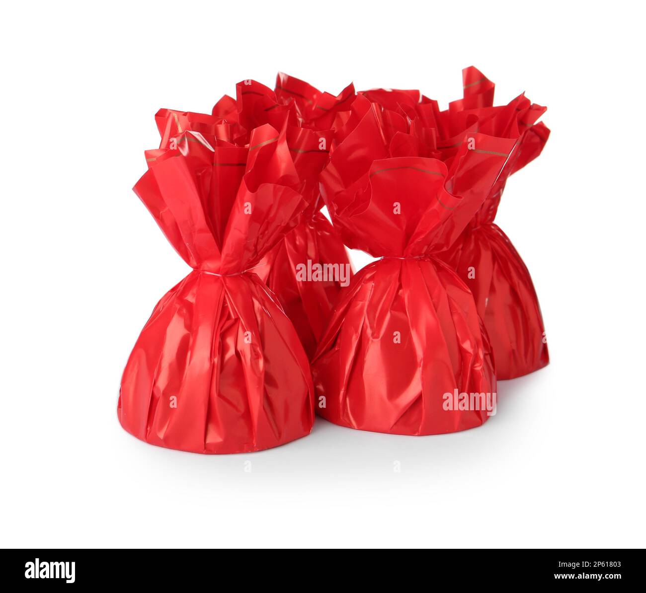 Delicious candies in red wrappers on white background Stock Photo - Alamy