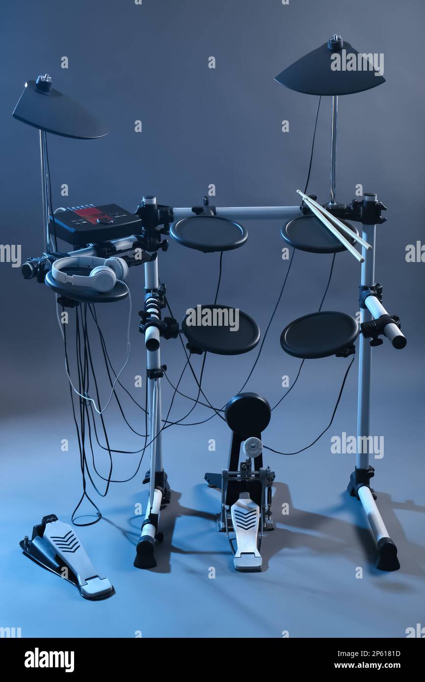 Modern electronic drum kit on grey background, toned in blue. Musical ...