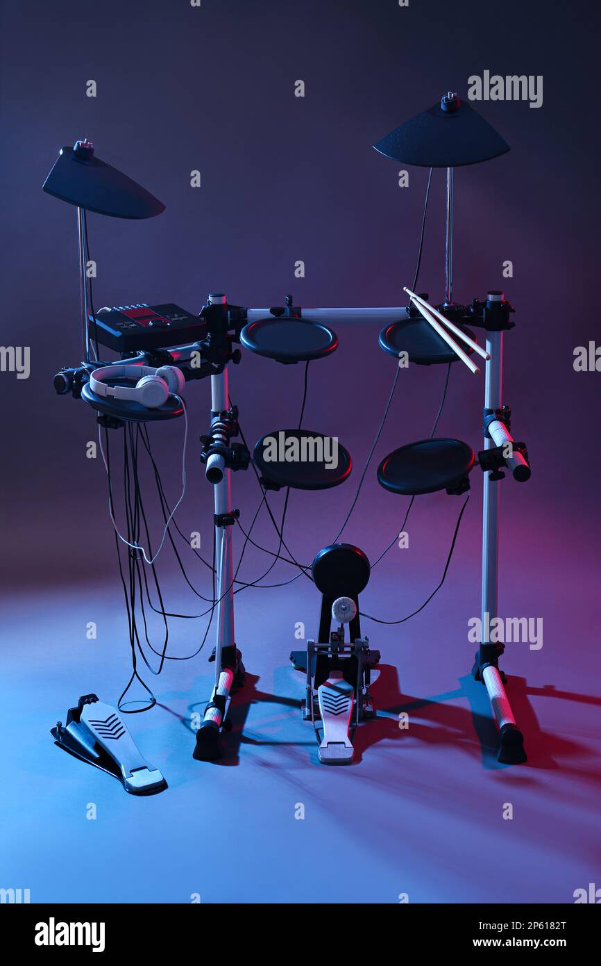 Modern electronic drum kit on grey background, color toned. Musical ...