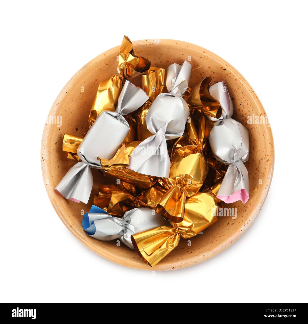 Bowl with candies in golden and silver wrappers isolated on white, top ...