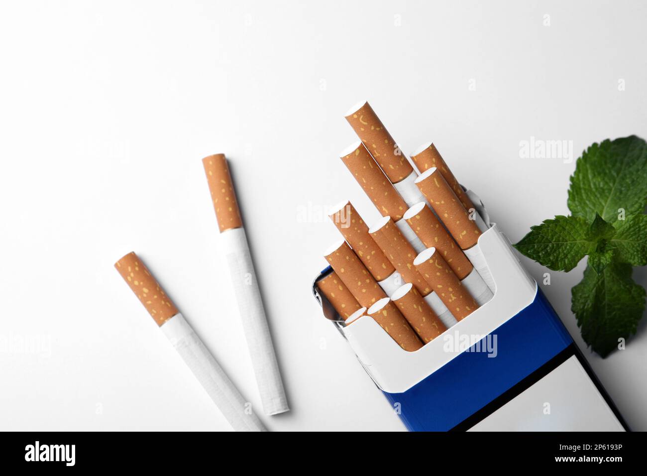 Menthol cigarettes and mint on white background, flat lay Stock Photo ...
