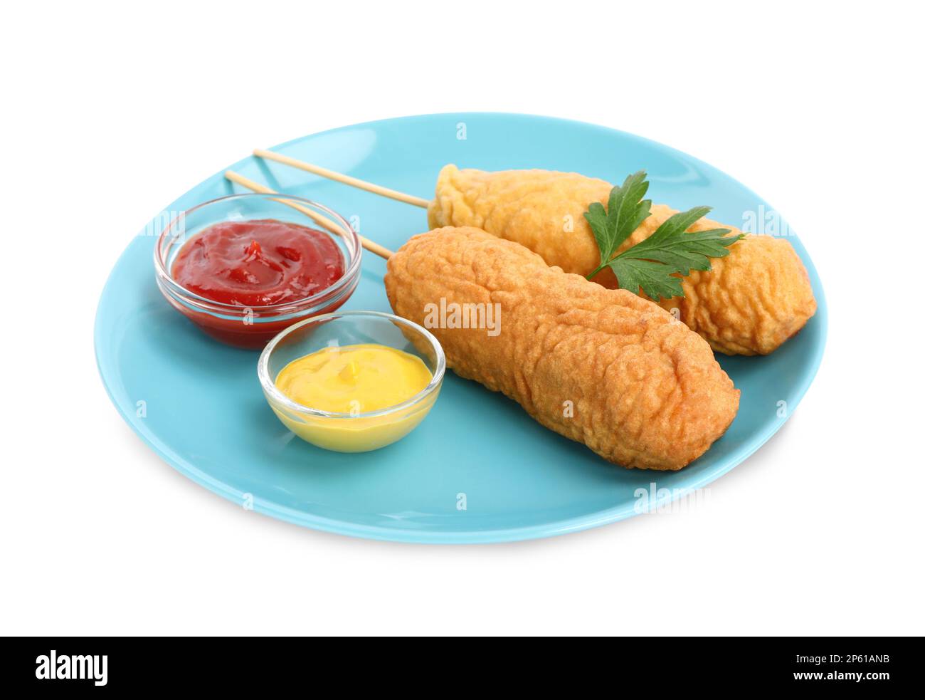 Delicious deep fried corn dogs with parsley and sauces on white ...